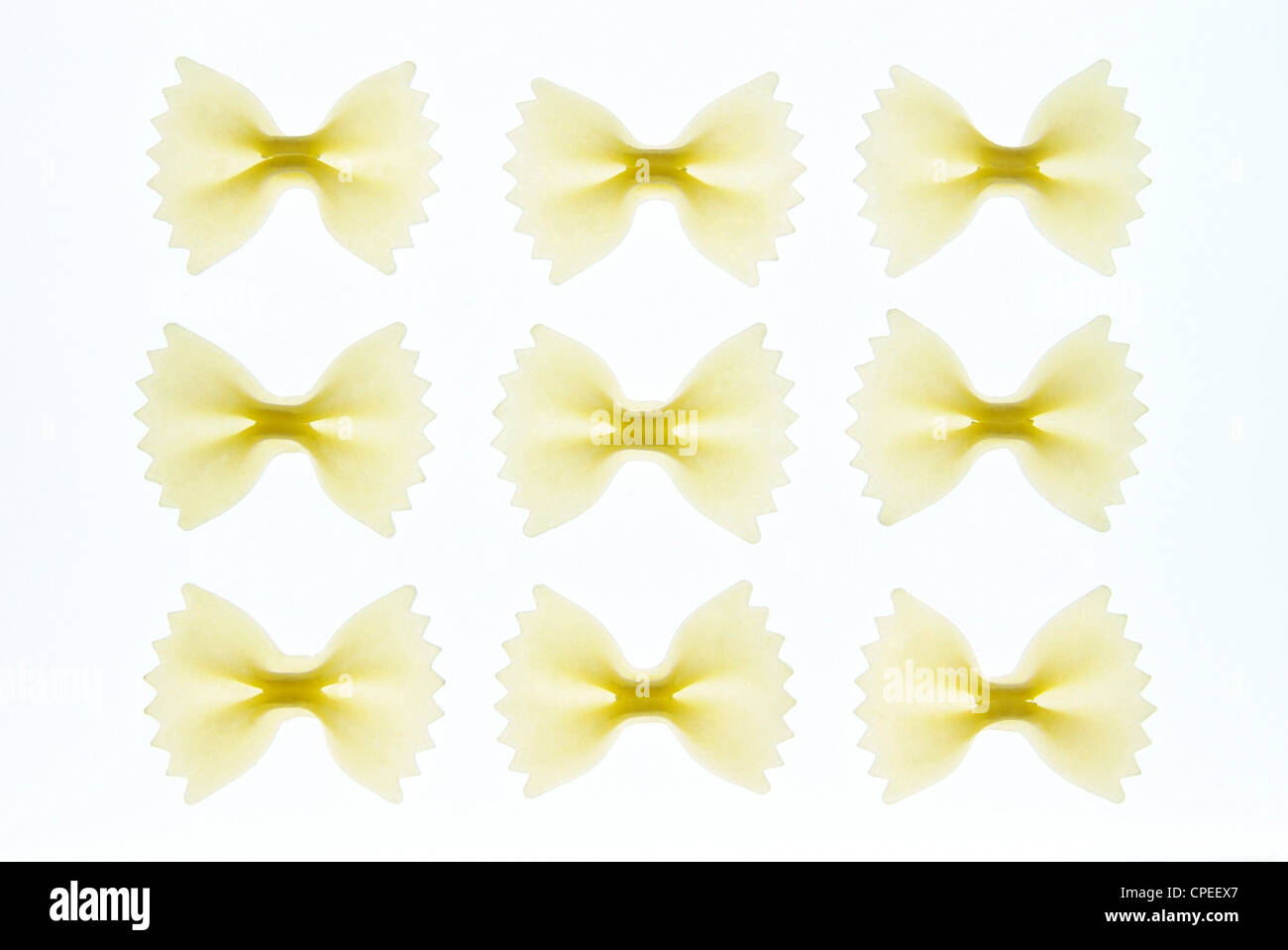 Pasta bows on white background Stock Photo - Alamy
