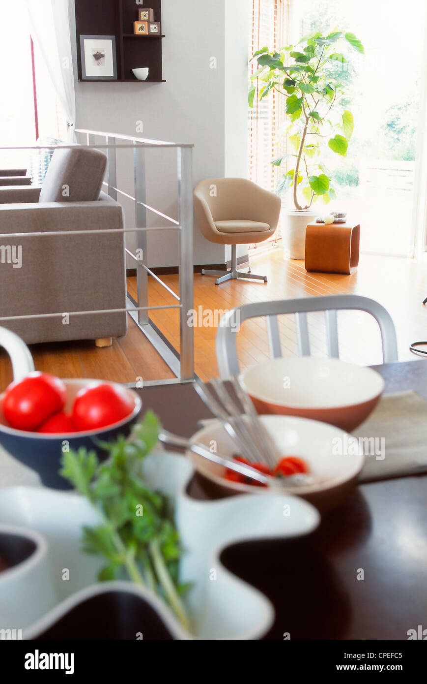 Dining Table In Open Plan In Modern House Stock Photo - Alamy