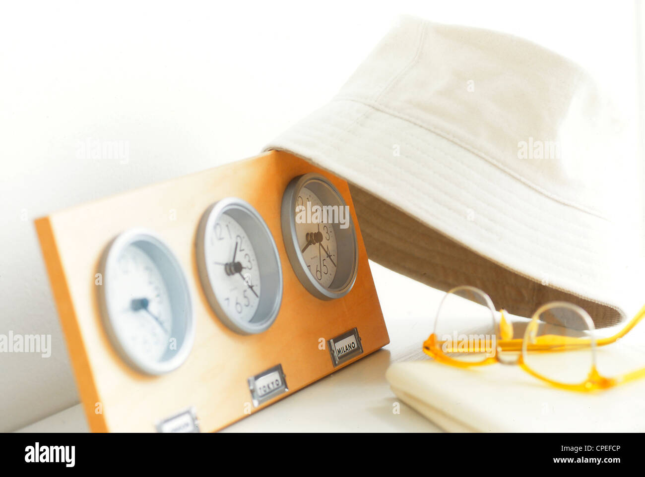 Close Up View Of Clock, Cap And Spectacles On Table Stock Photo - Alamy