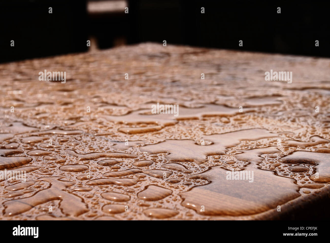 Rain drops on wooden table after rain (shallow DOF Stock Photo - Alamy