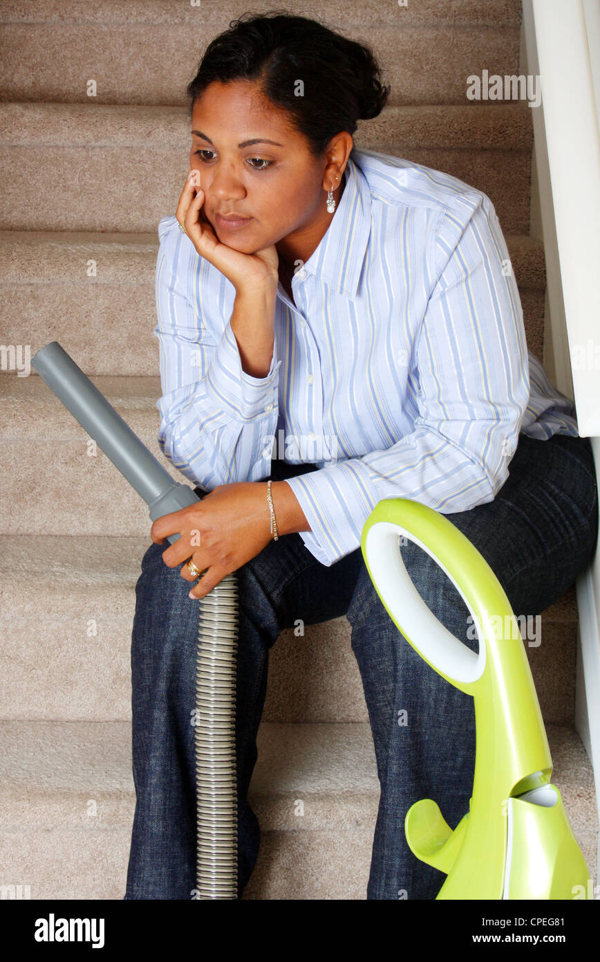 Woman cleaning in her house with a vacuum cleaner Stock Photo - Alamy