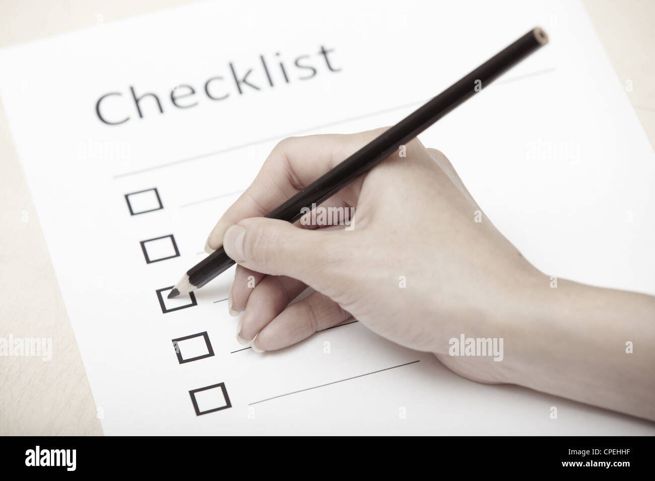 Human hand writing on a checklist document Stock Photo - Alamy