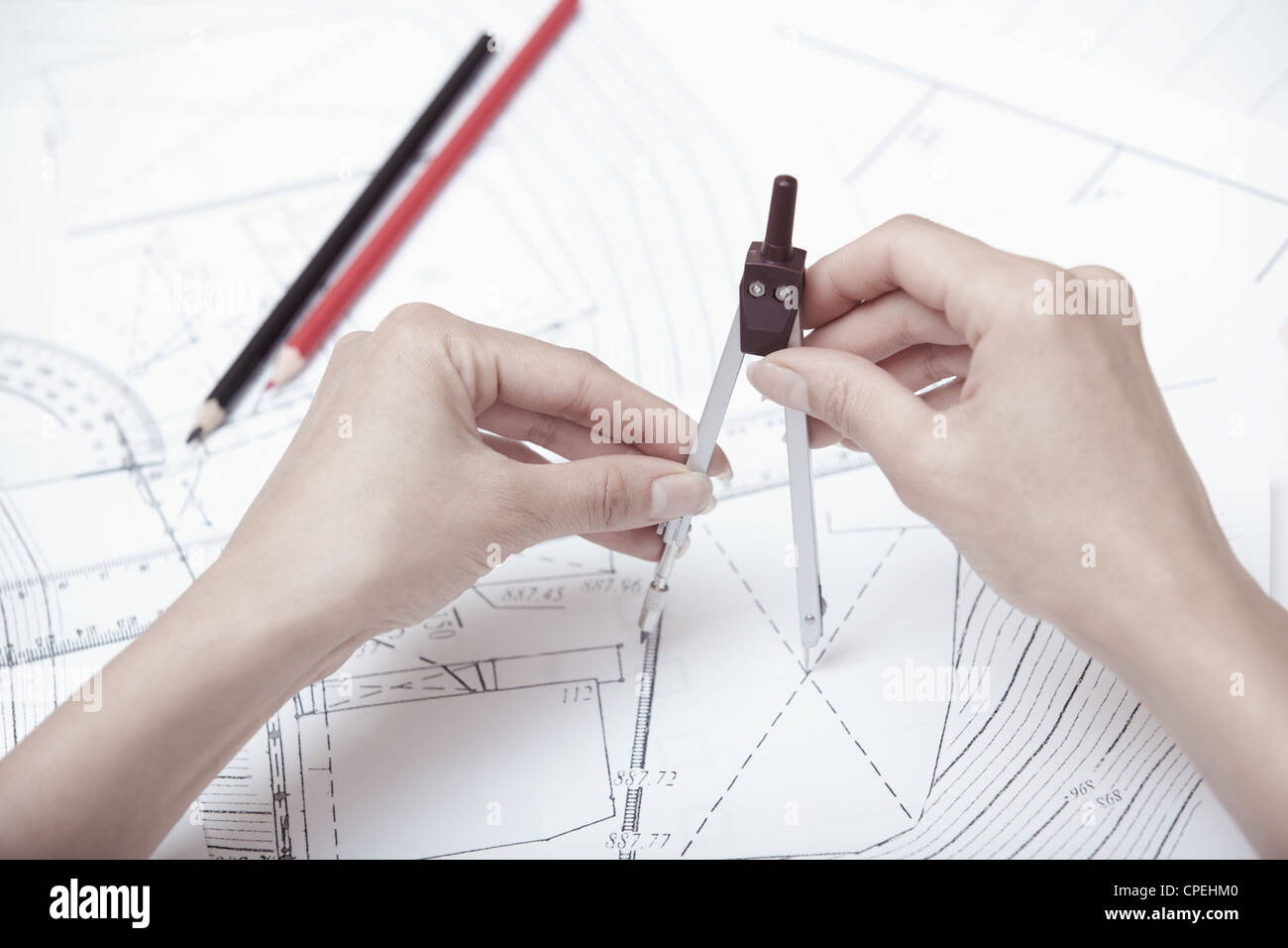 Hands of engineer working on a construction plan Stock Photo - Alamy