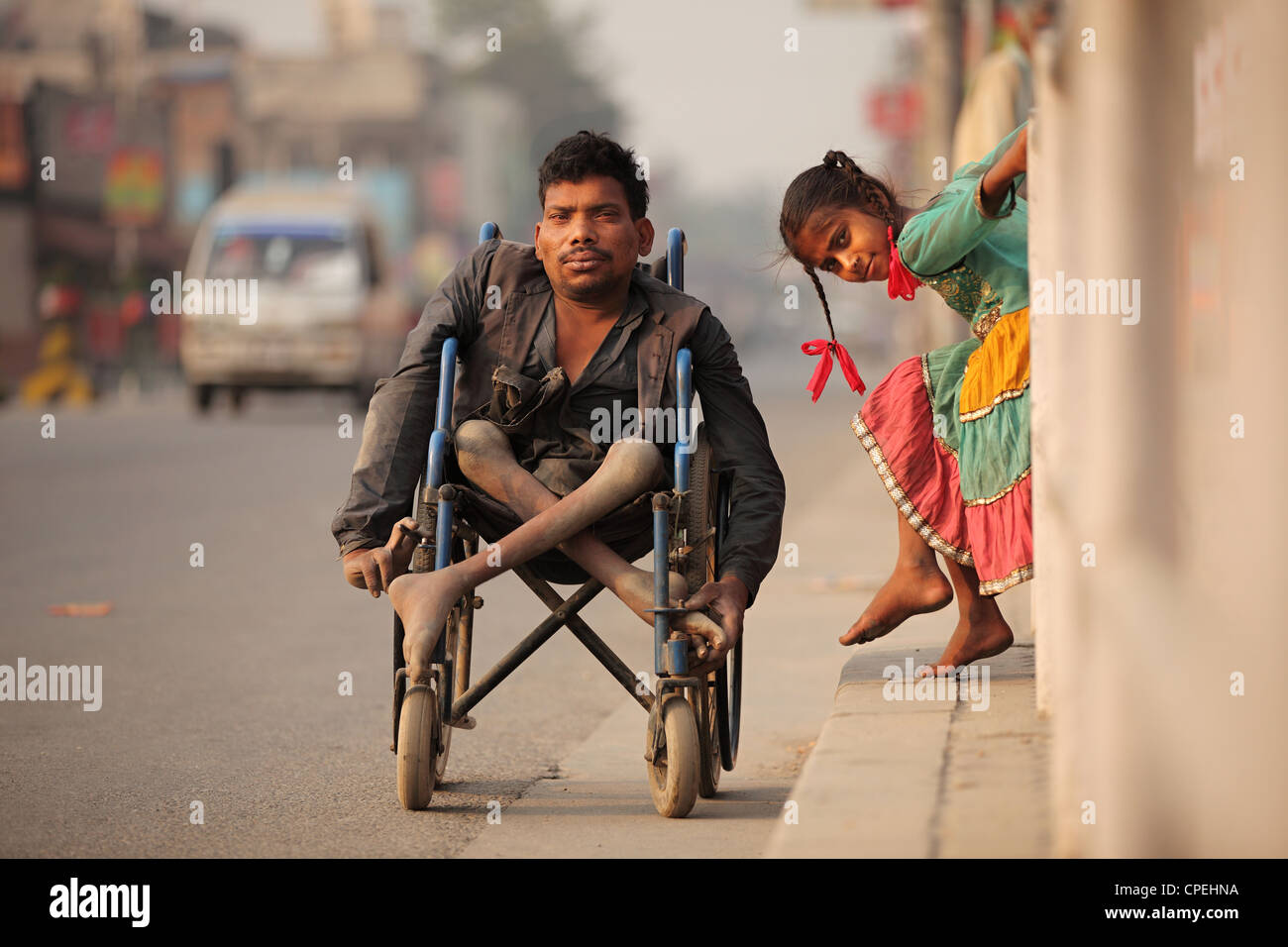 Handicapped men with also handicapped girl helping Kathmandu Nepal ...
