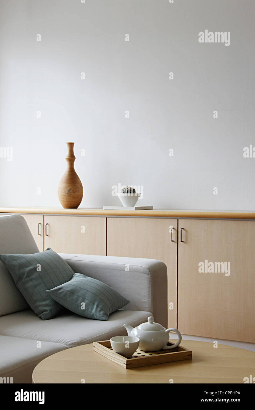 Tea Set On Table Alongside Sofa Stock Photo - Alamy