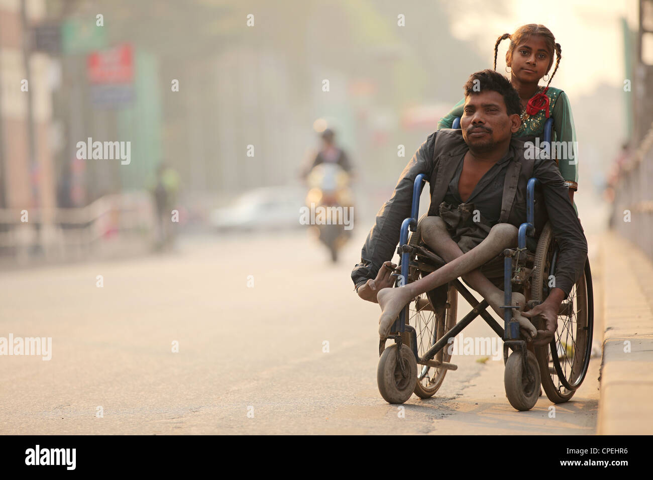 Handicapped men with also handicapped girl helping Kathmandu Nepal ...