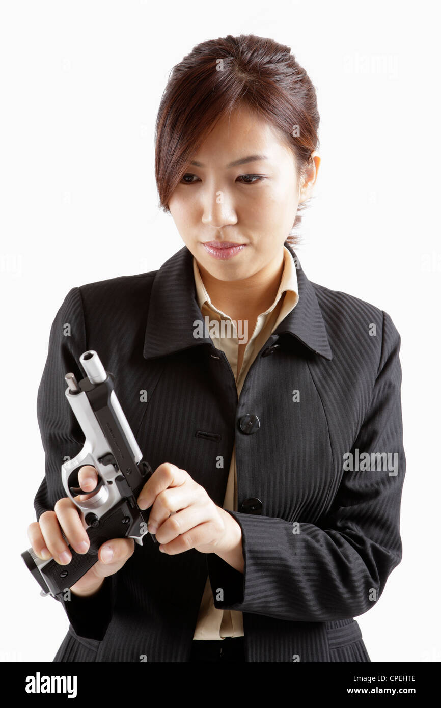 Portrait of office lady playing gun Stock Photo - Alamy
