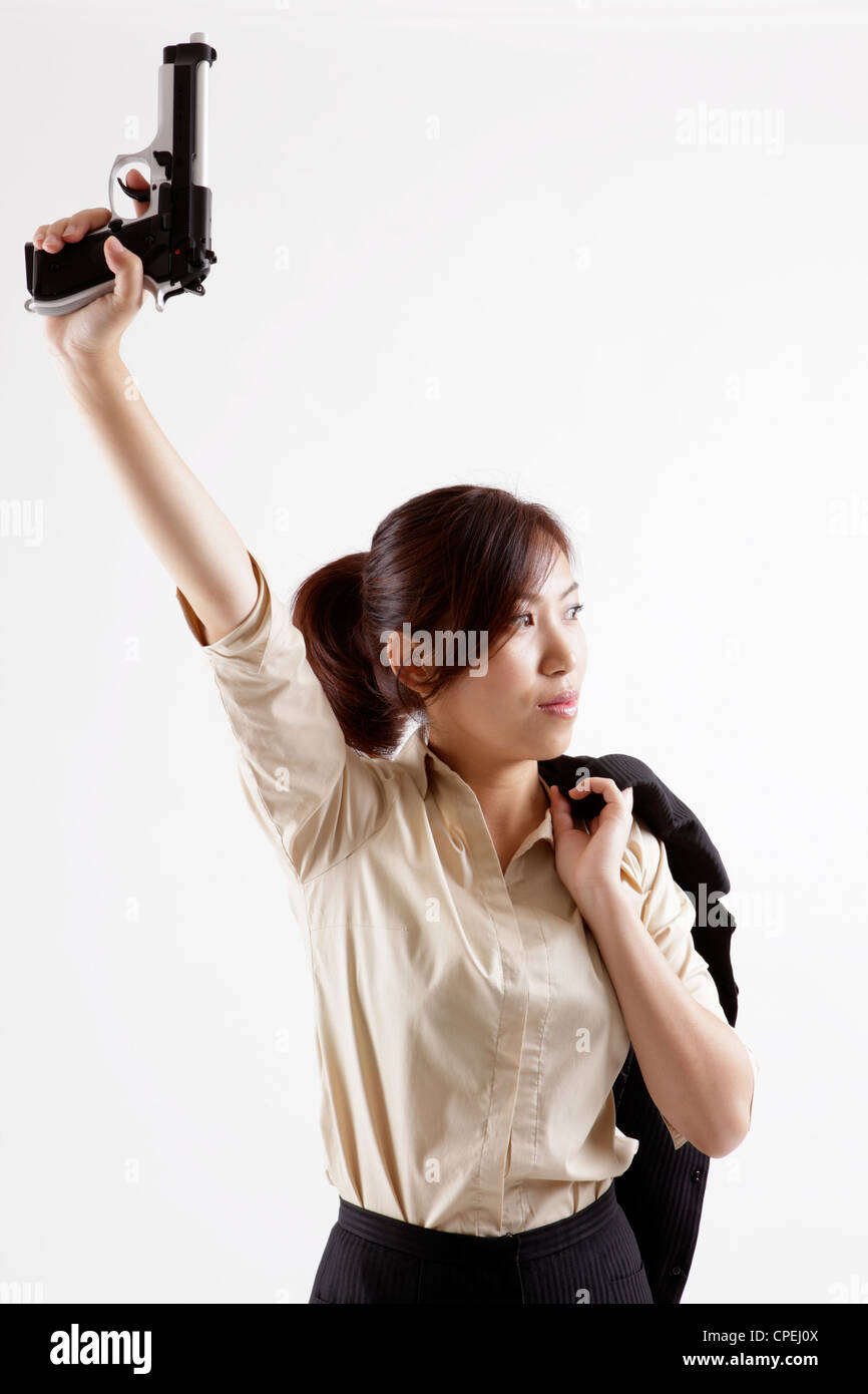 Portrait of office lady playing gun Stock Photo - Alamy