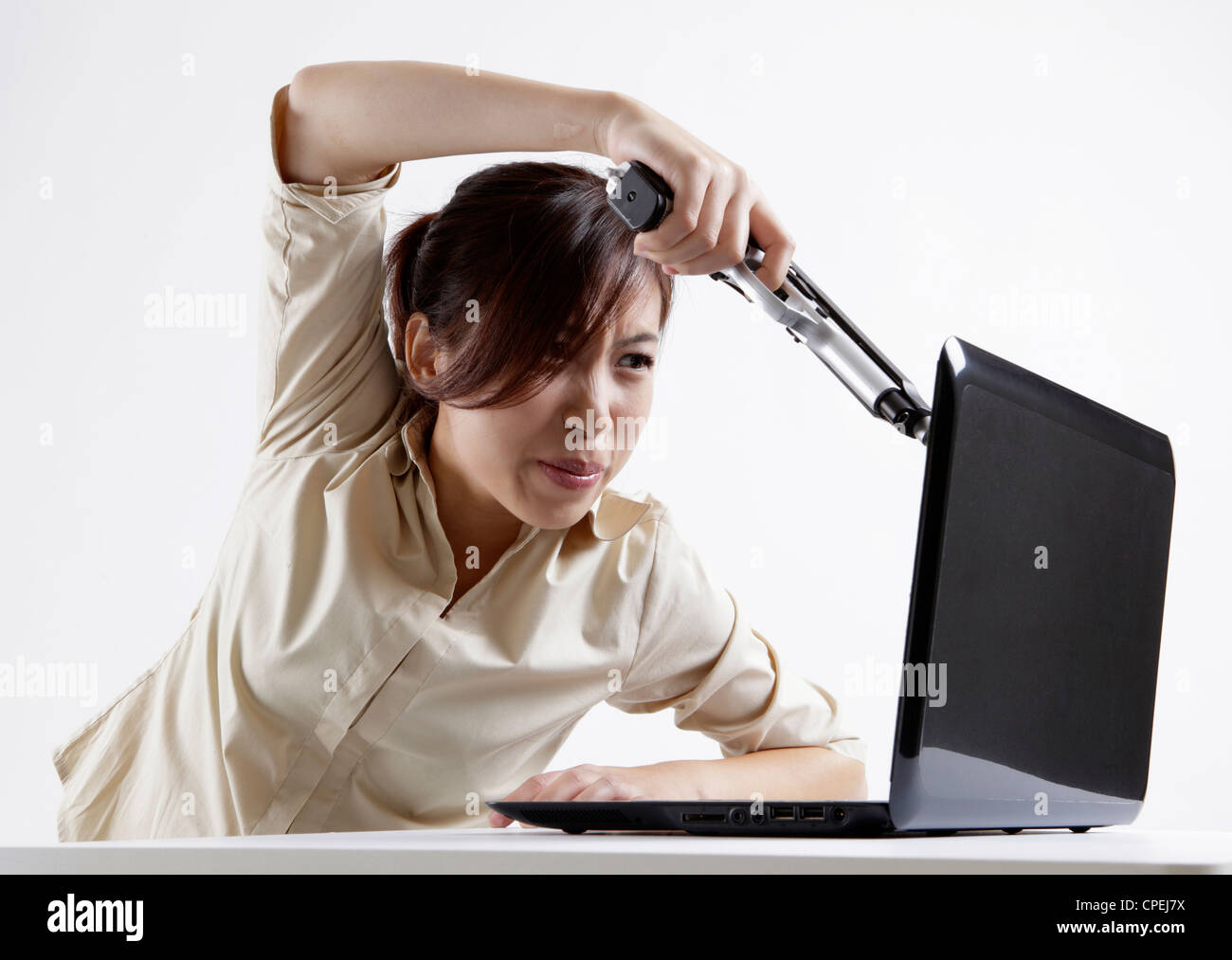 Office lady is tired of working and wants to shoot computer Stock Photo ...