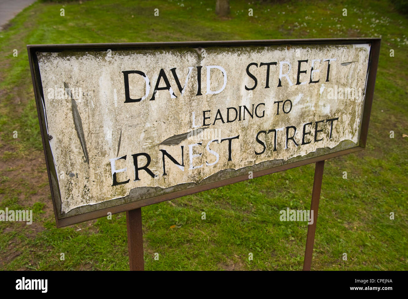 DAVID STREET LEADING TO ERNEST STREET scruffy street sign in Merthyr ...