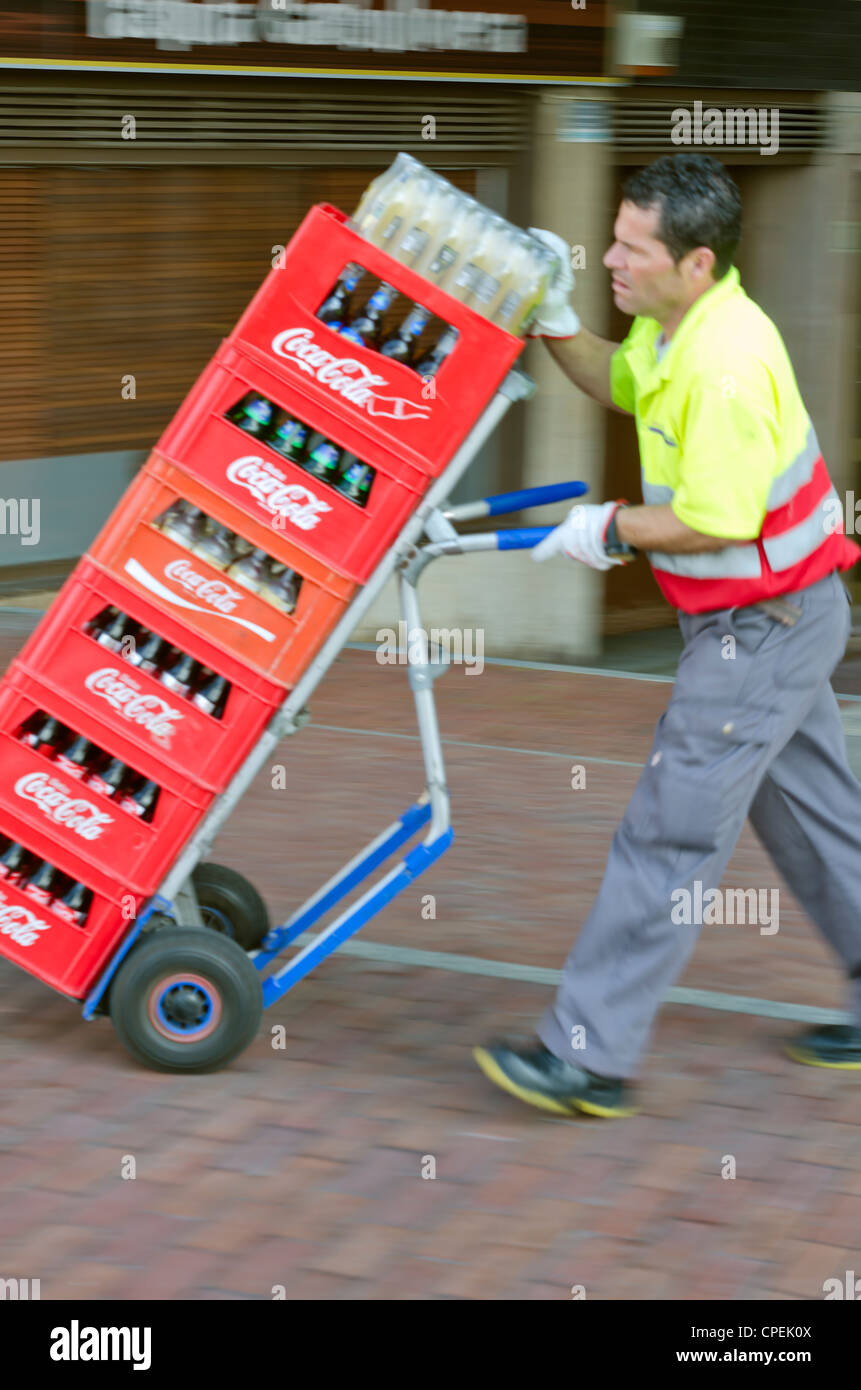 man delivering coca cola Stock Photo - Alamy