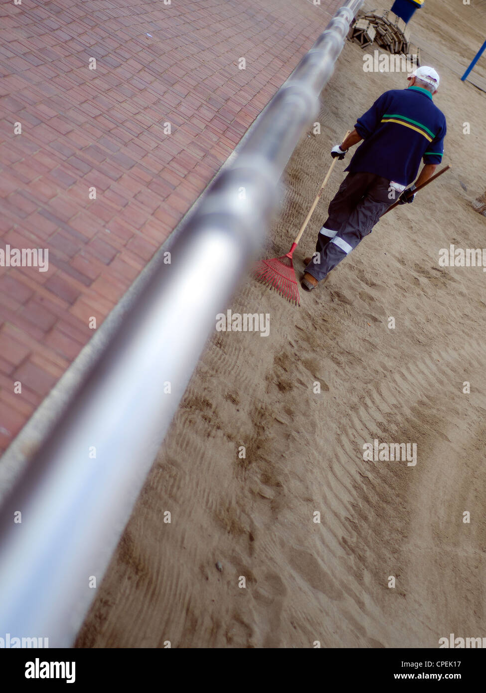 beach cleaner working Stock Photo - Alamy