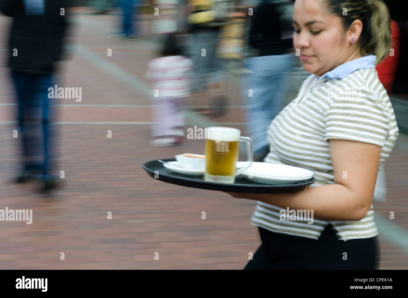 waitress with a beer Stock Photo - Alamy