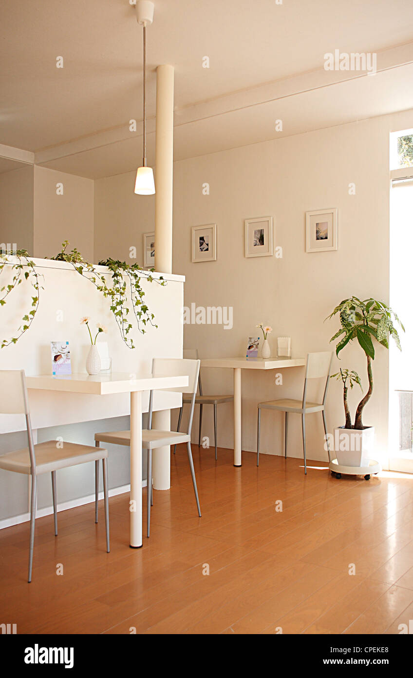 Modern White Dining Table In Open Plan Stock Photo - Alamy