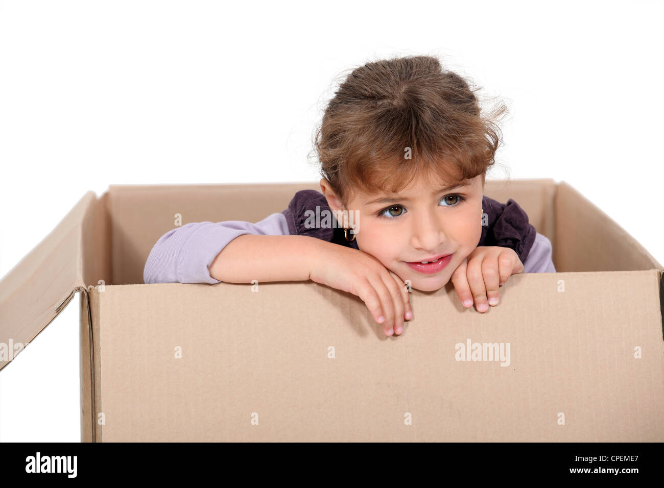 Girl in a cardboard box Stock Photo - Alamy