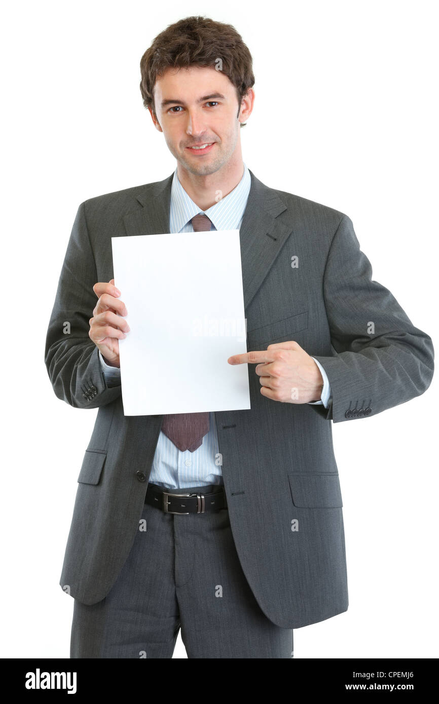 Modern businessman pointing on blank paper sheet Stock Photo - Alamy