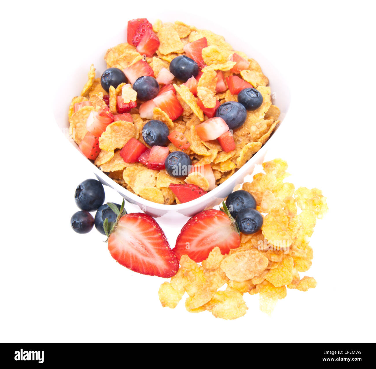 Cornflakes with fresh fruits in a bowl isolated on white background ...