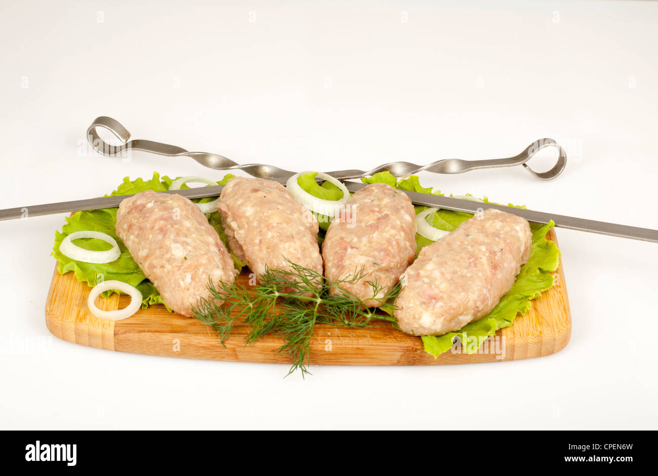forcemeat chicken molded to kebab skewers with Stock Photo - Alamy