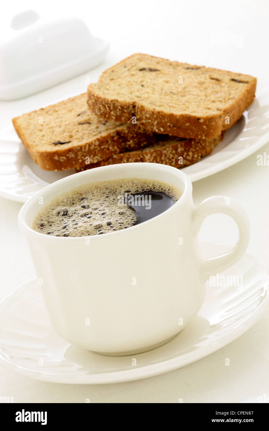 delicious breakfast with fresh hot coffee, butter and whole grain bread ...