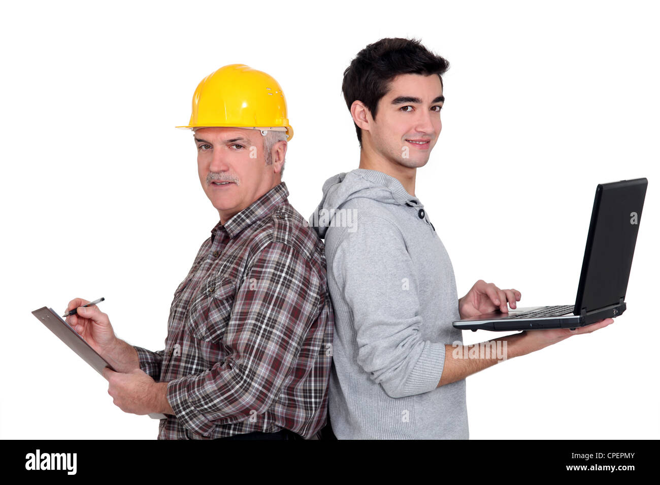 A handyman and his apprentice Stock Photo - Alamy