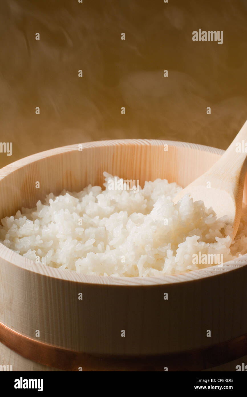 Bowl Of Rice With Wood Spoon Stock Photo - Alamy