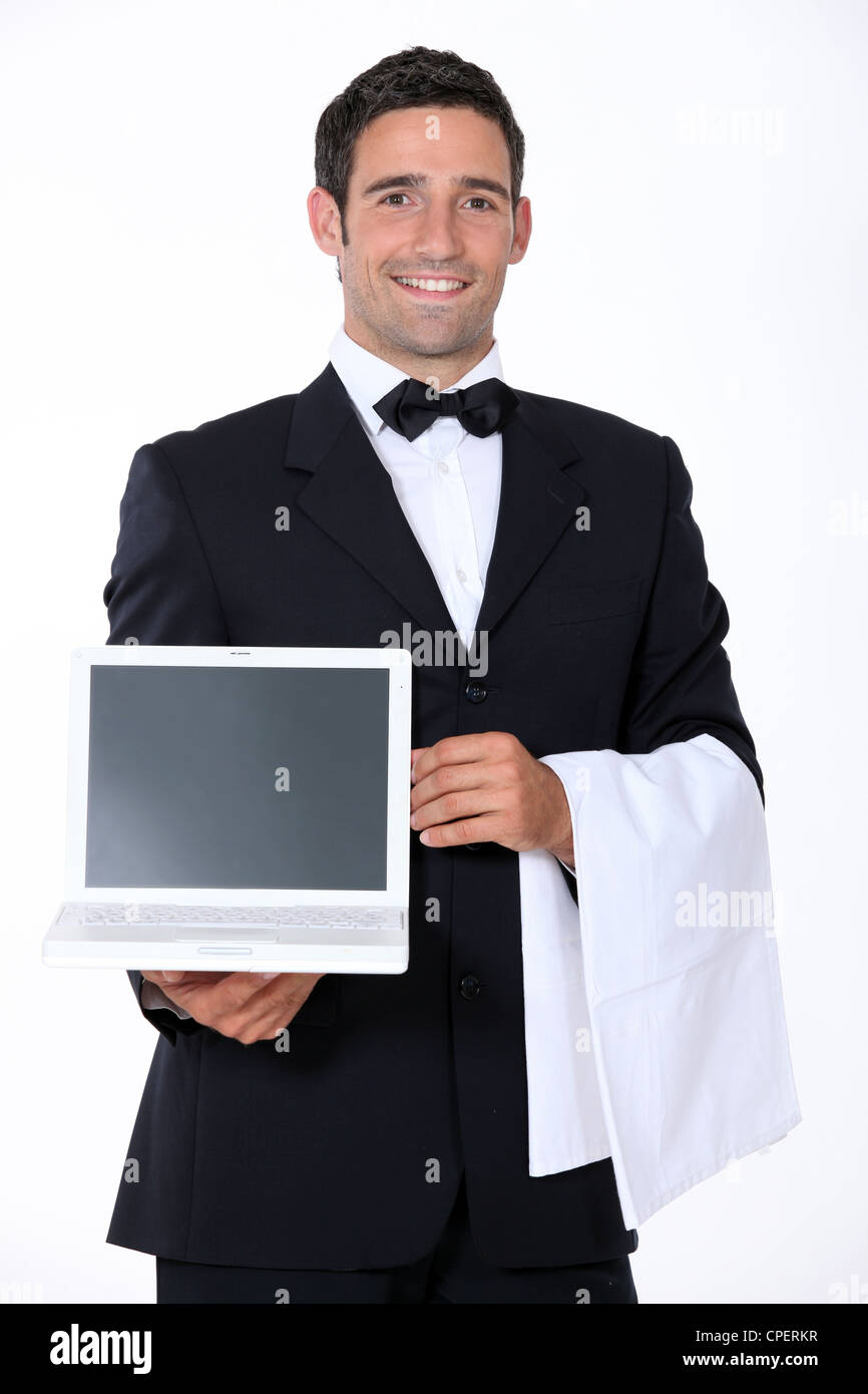 Waiter with computer Stock Photo - Alamy