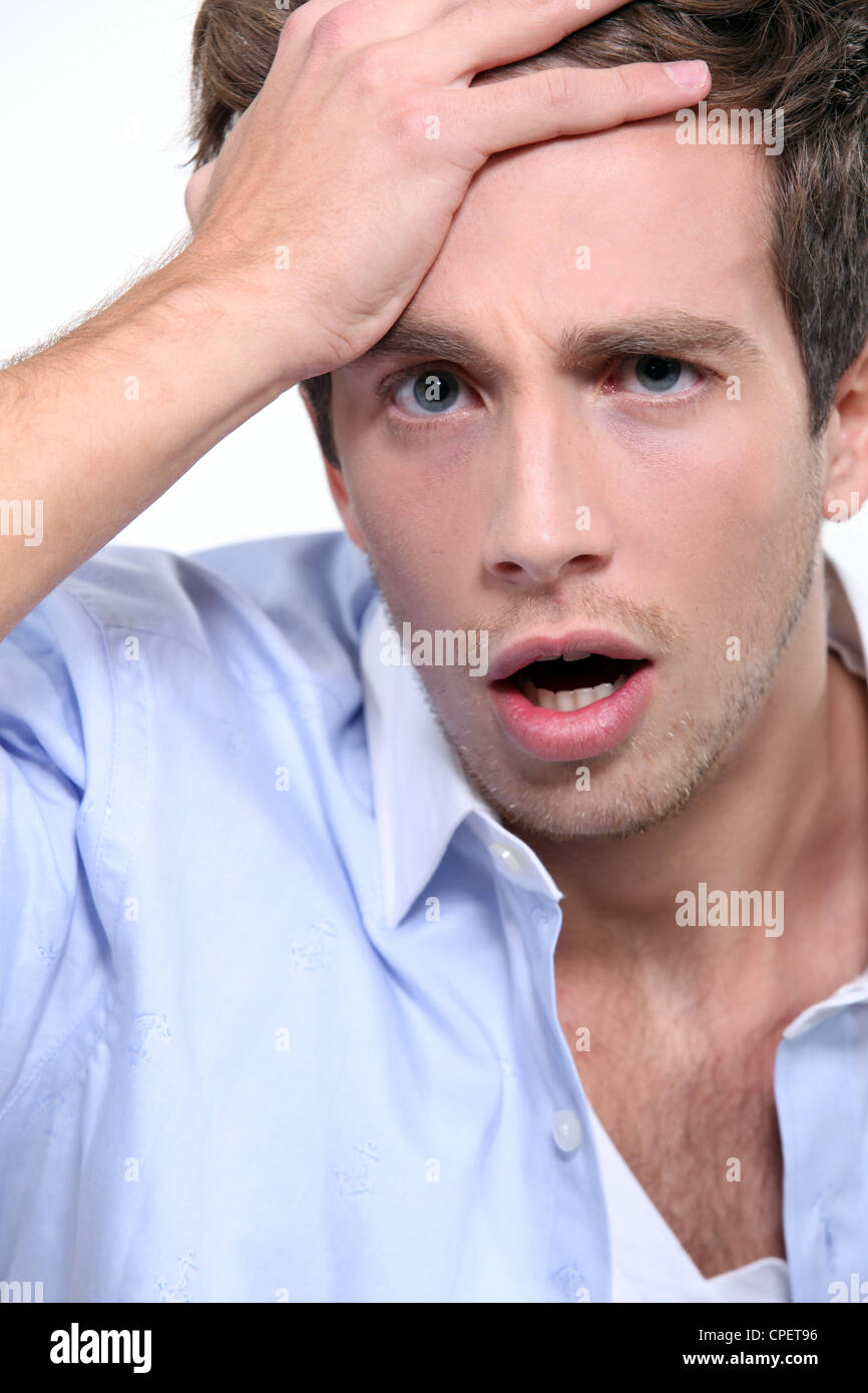 young man in moment of panic Stock Photo - Alamy