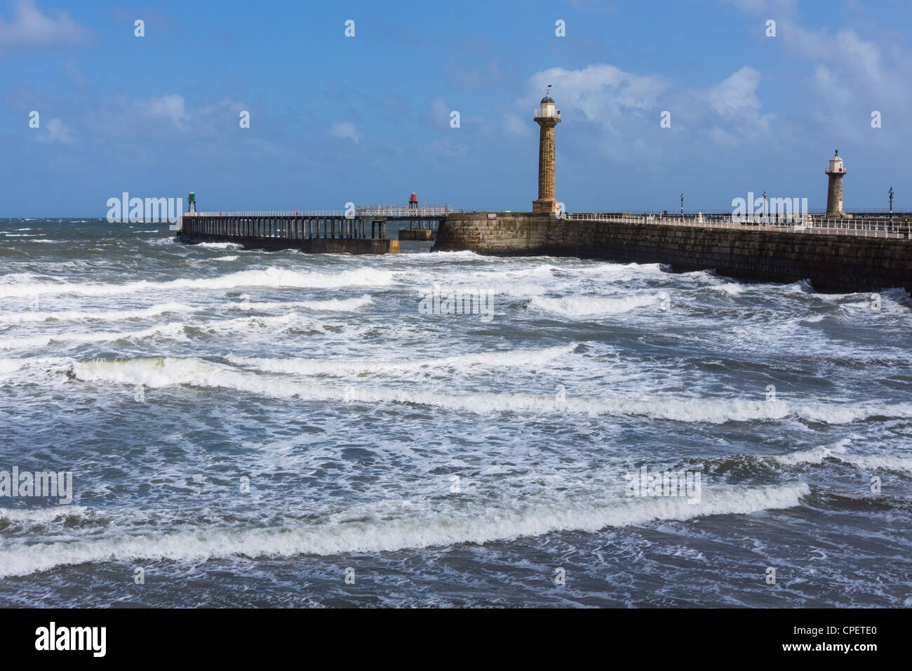 Whitby Harbour - lighthouse and waves Stock Photo - Alamy