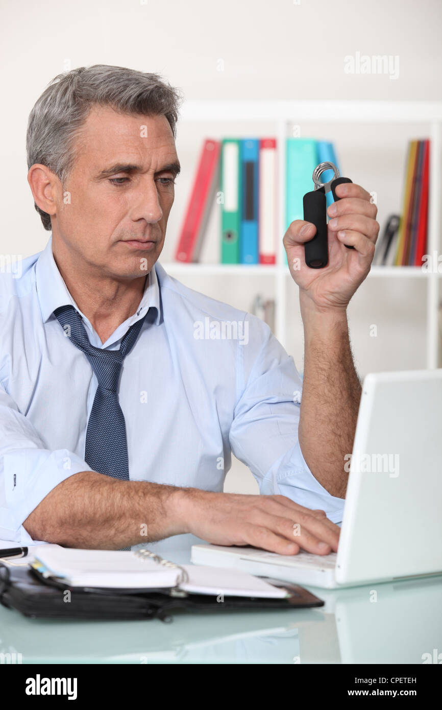 Executive office with hand tensioner Stock Photo - Alamy