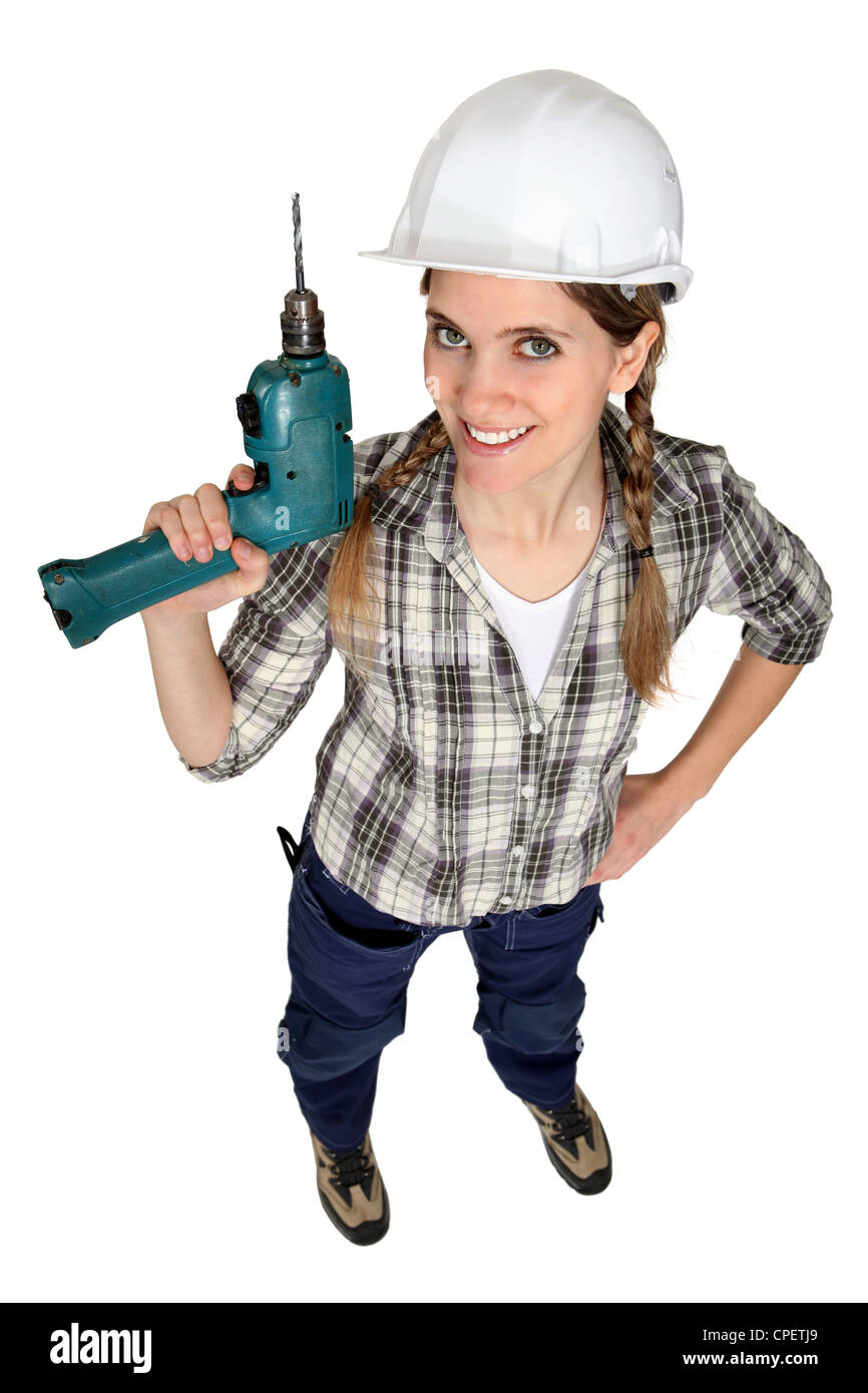 Young woman holding hammer drill hi-res stock photography and images ...