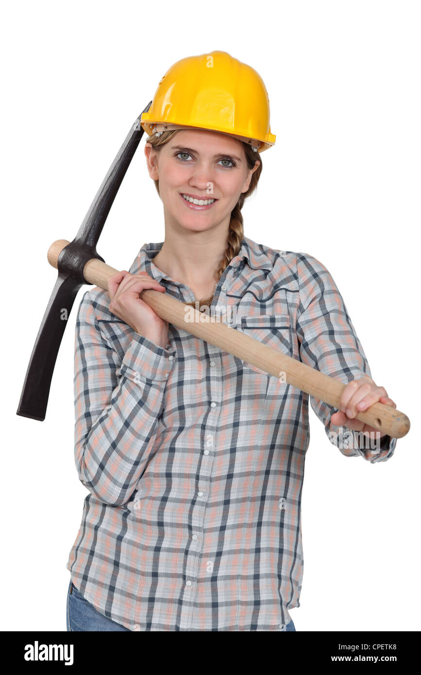 Tradeswoman holding a pickaxe Stock Photo - Alamy