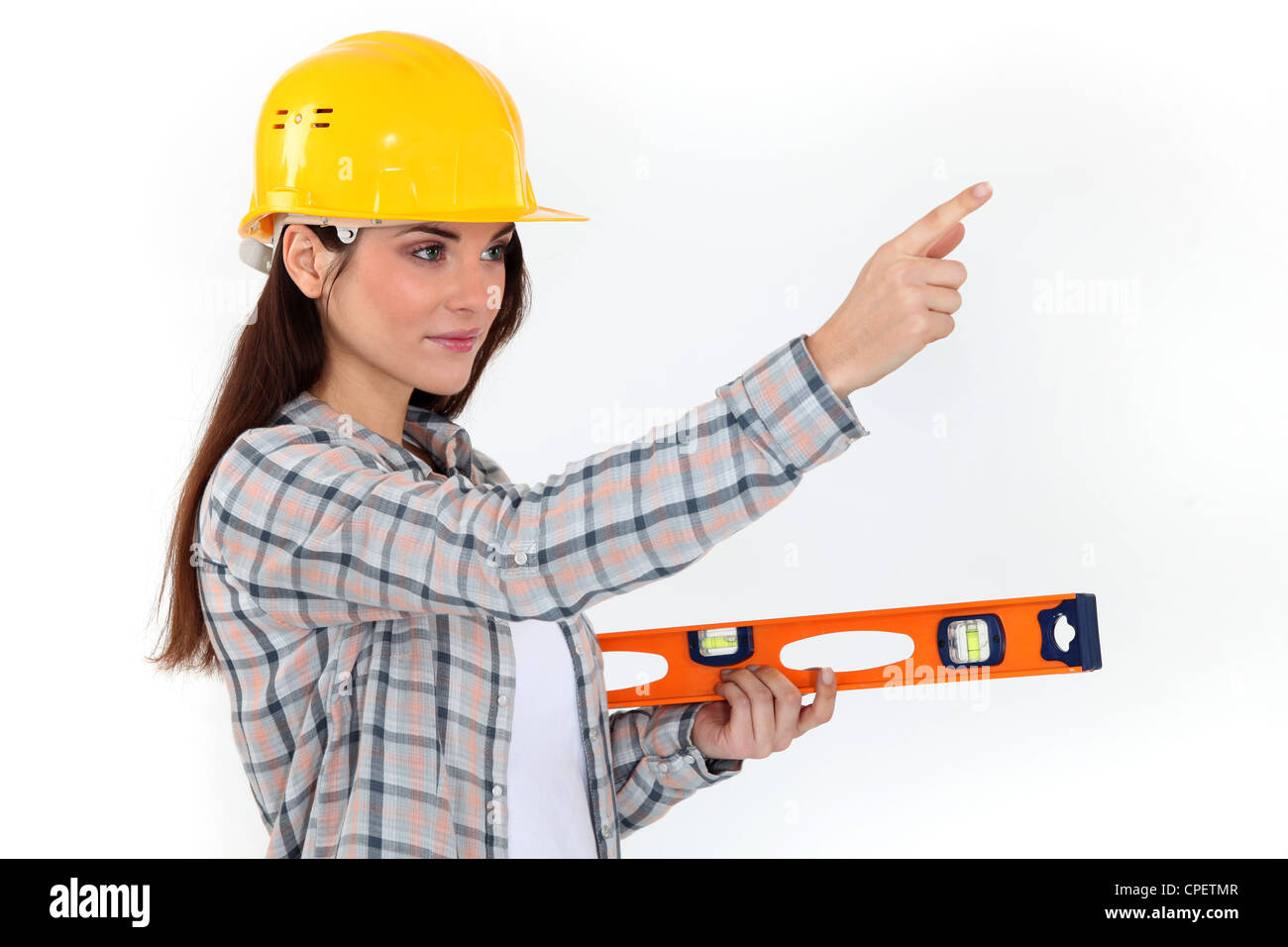 Young woman with spirit level Stock Photo - Alamy