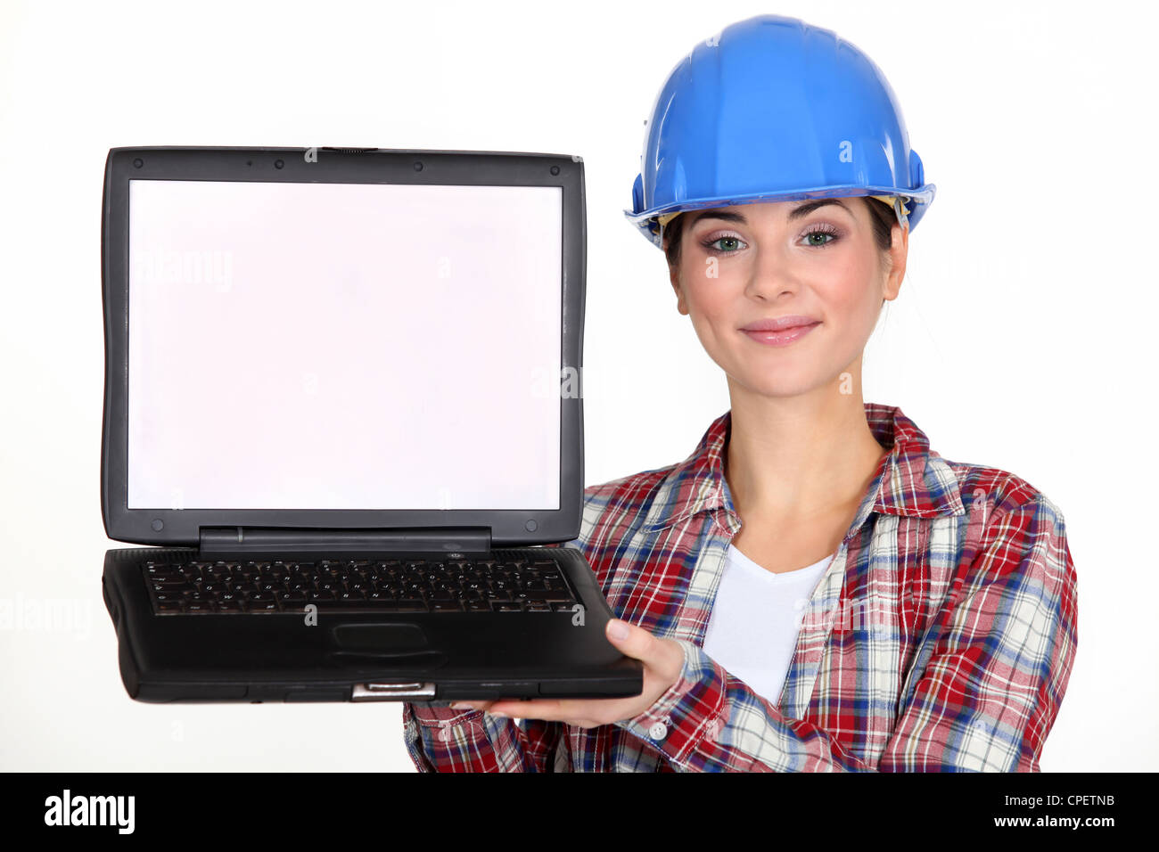A female construction worker presenting a laptop Stock Photo - Alamy