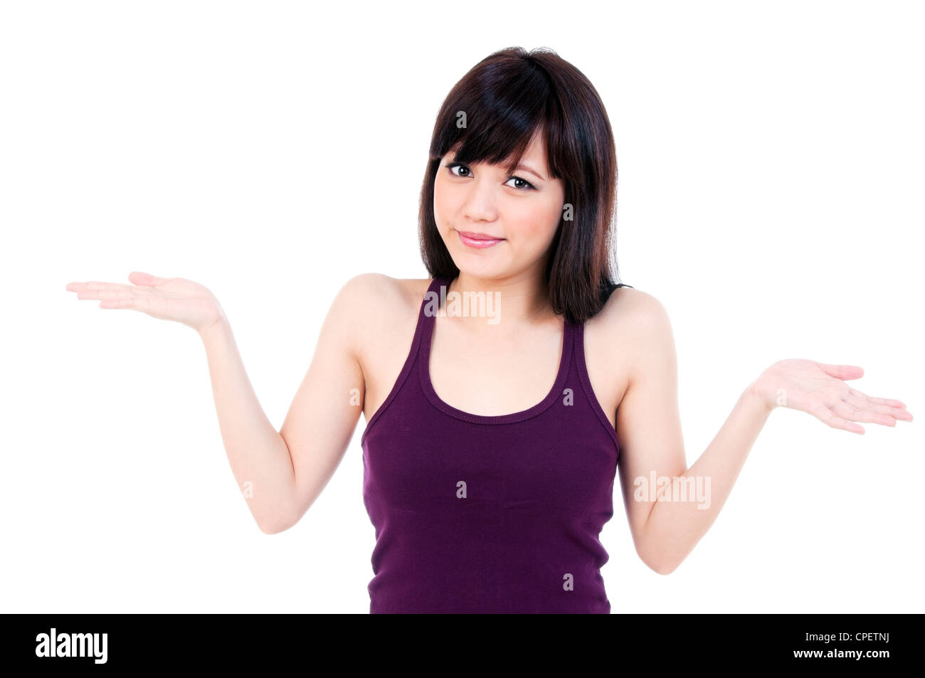 Cute young woman presenting things with her hands Stock Photo - Alamy