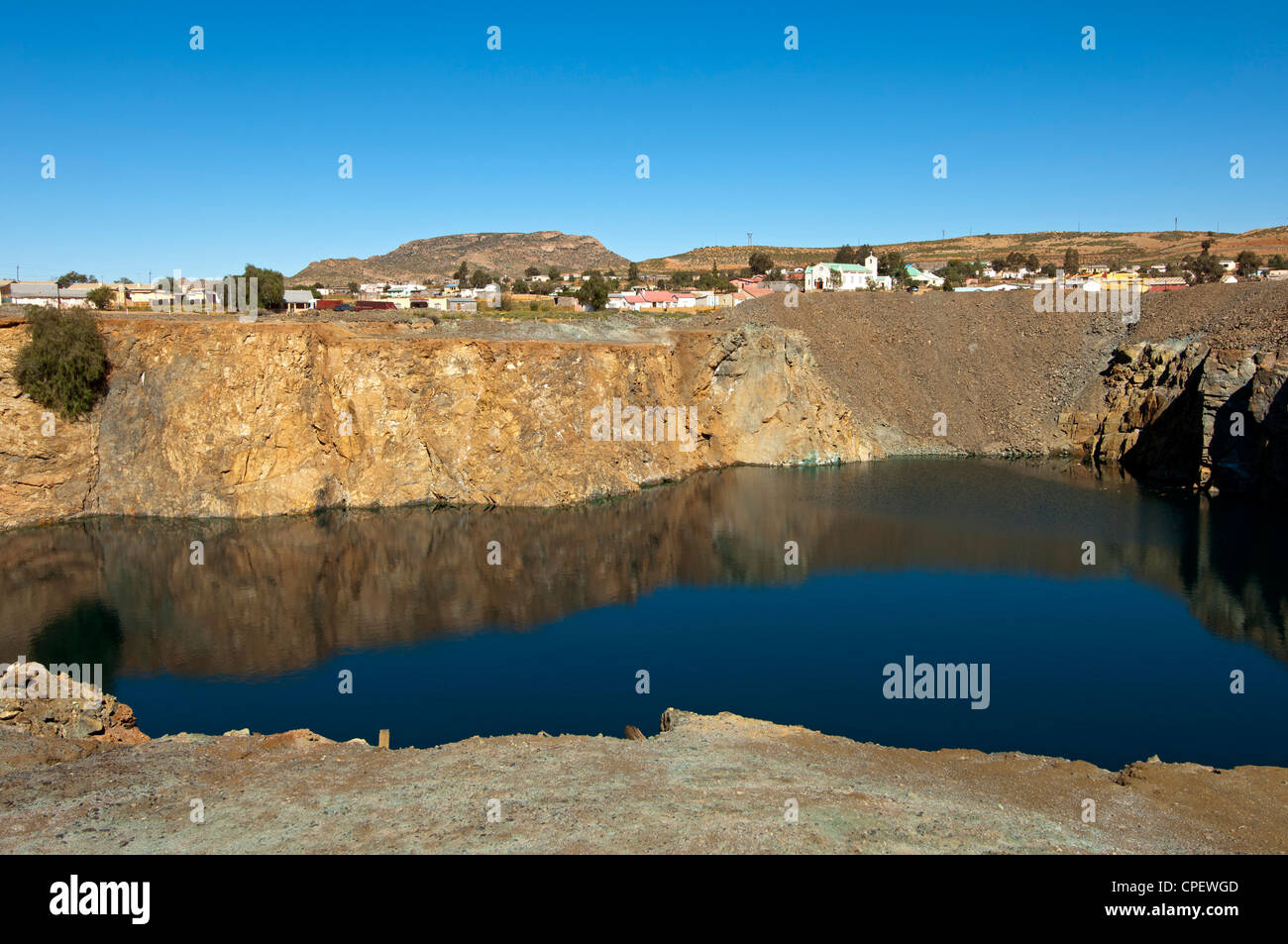 Flooded mining hole of a copper mine, Okiep, Northern Cape province ...