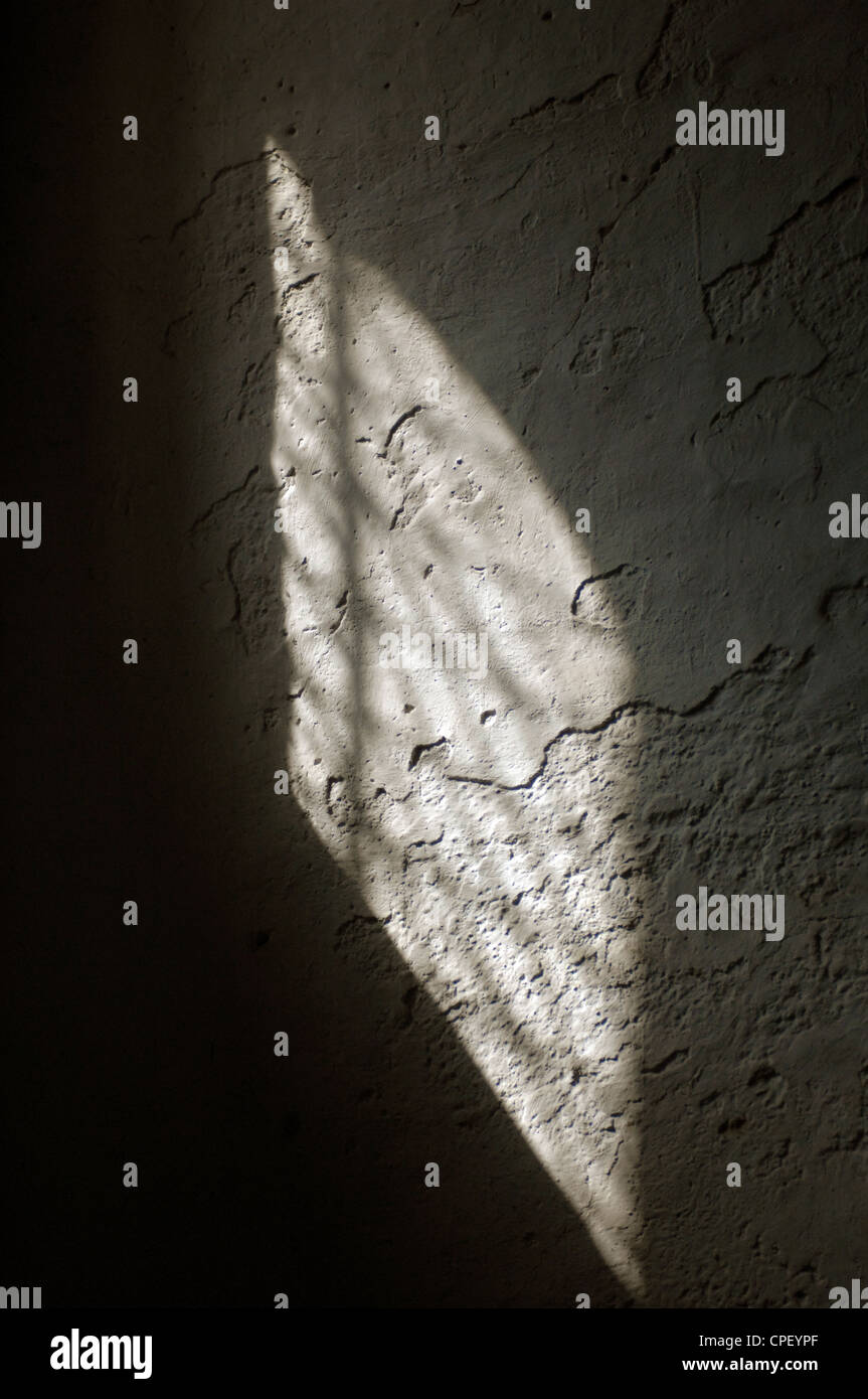 Light from a window reflecting on wall, UK Stock Photo - Alamy