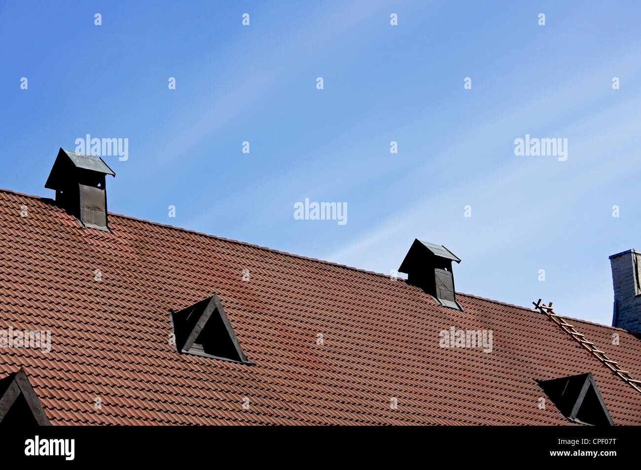 Pipe of ventilation and windows on a roof of tiles Stock Photo - Alamy