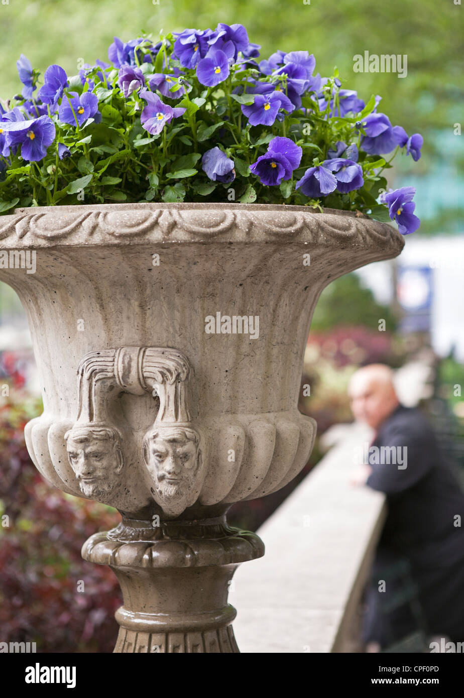 An ornate planter holds flowers in Bryant Park in New York City Stock ...