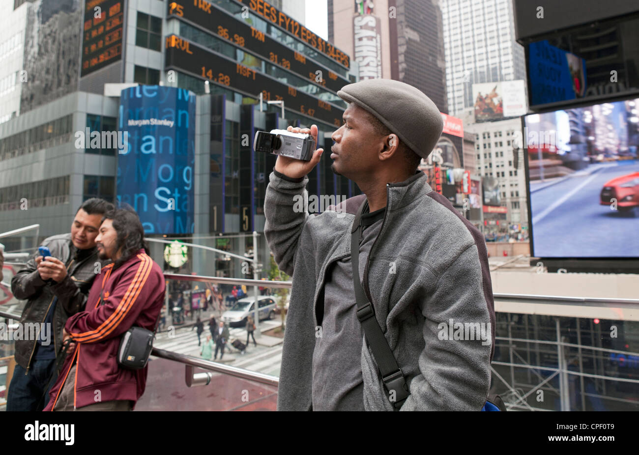 A man shoots videos in Times Square in New York City Stock Photo - Alamy