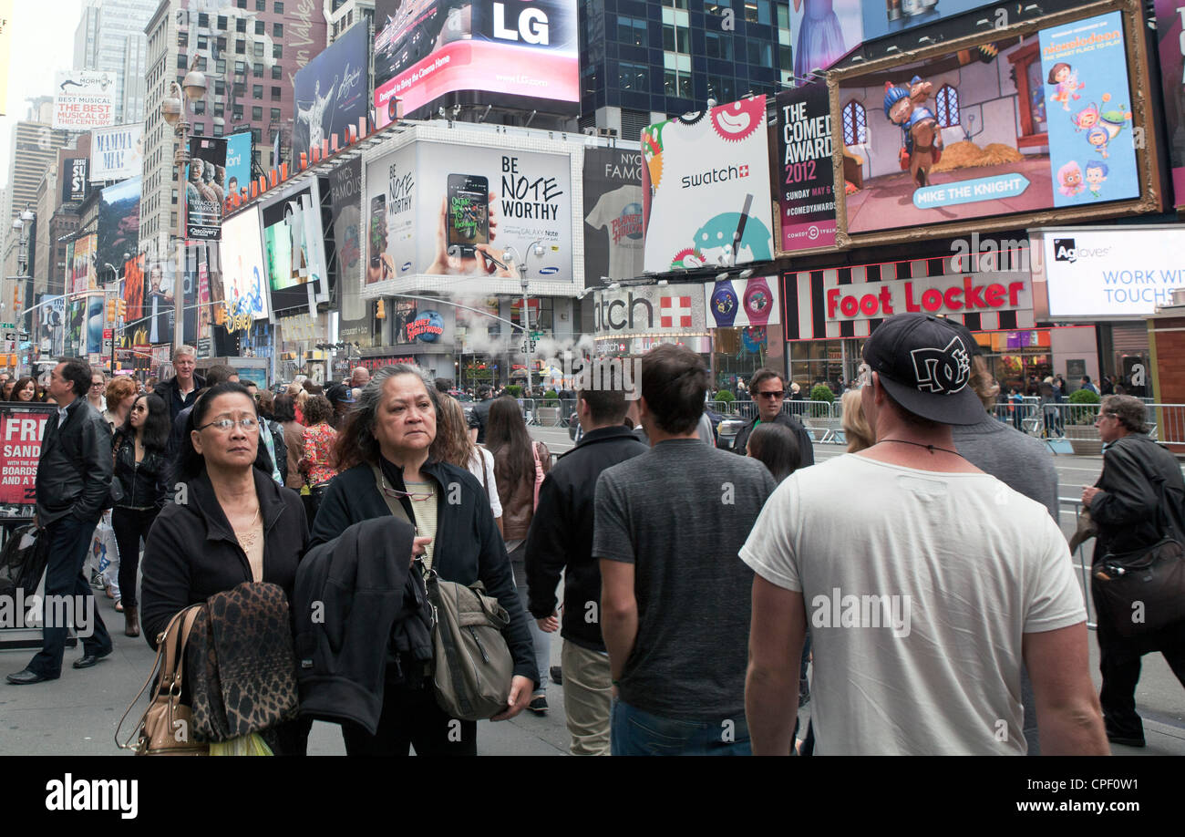 2 women stroll through Times Square in New York City Stock Photo - Alamy