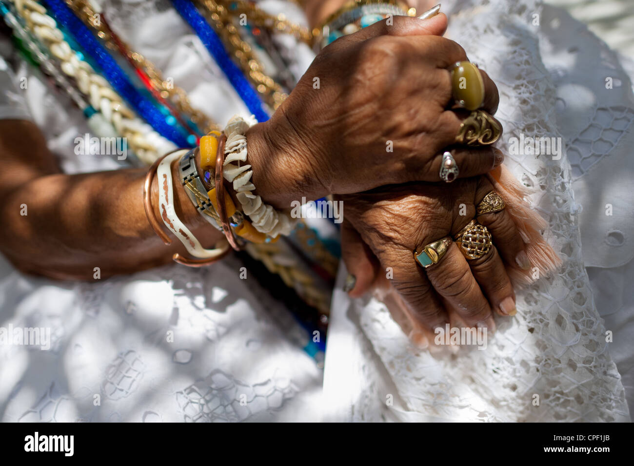 Hands of a priestess of Candomblé seen during the ritual ceremony in ...