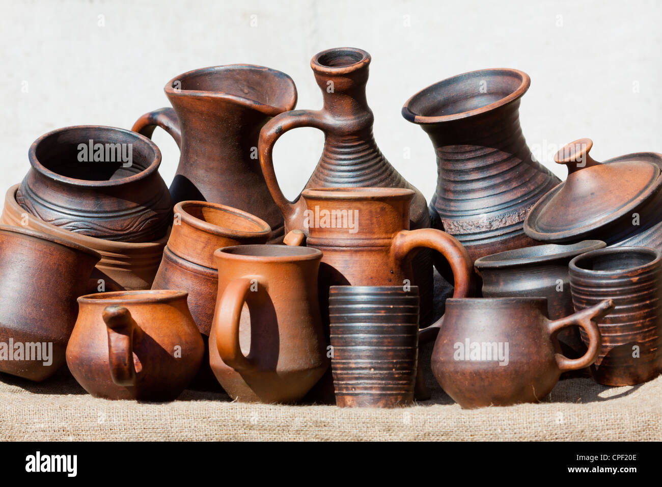 Clayware with designs. A set of handmade pottery Stock Photo - Alamy