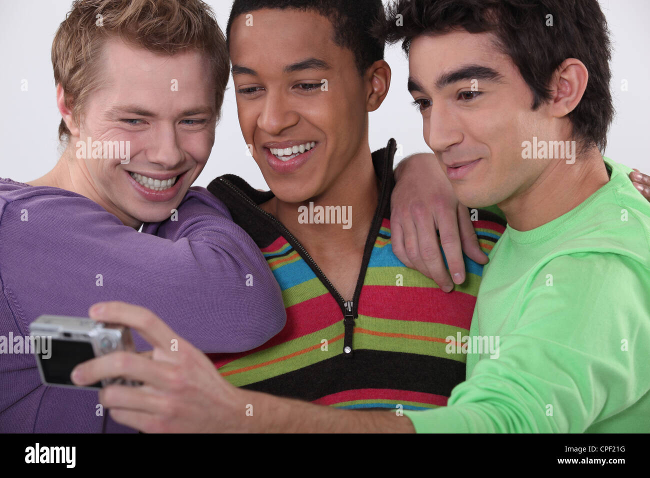 Three men pose for a picture hi-res stock photography and images - Alamy