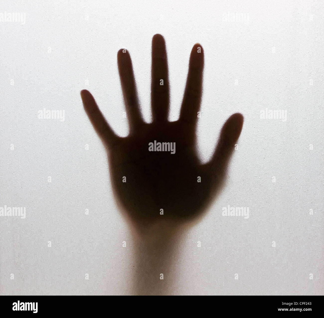 Shadow of blurry hand behind the frost glass Stock Photo - Alamy