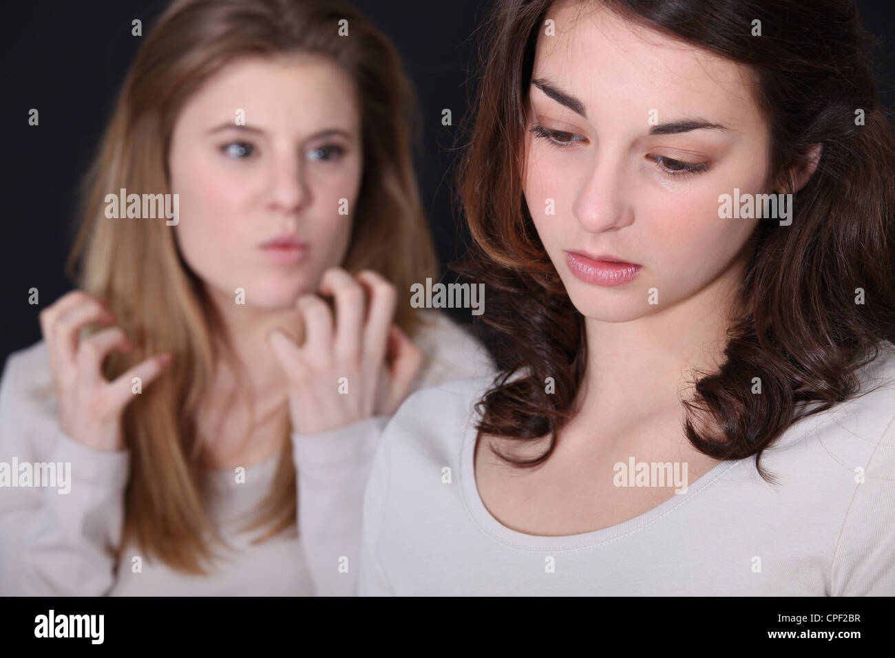 Two female friends having an argument Stock Photo - Alamy