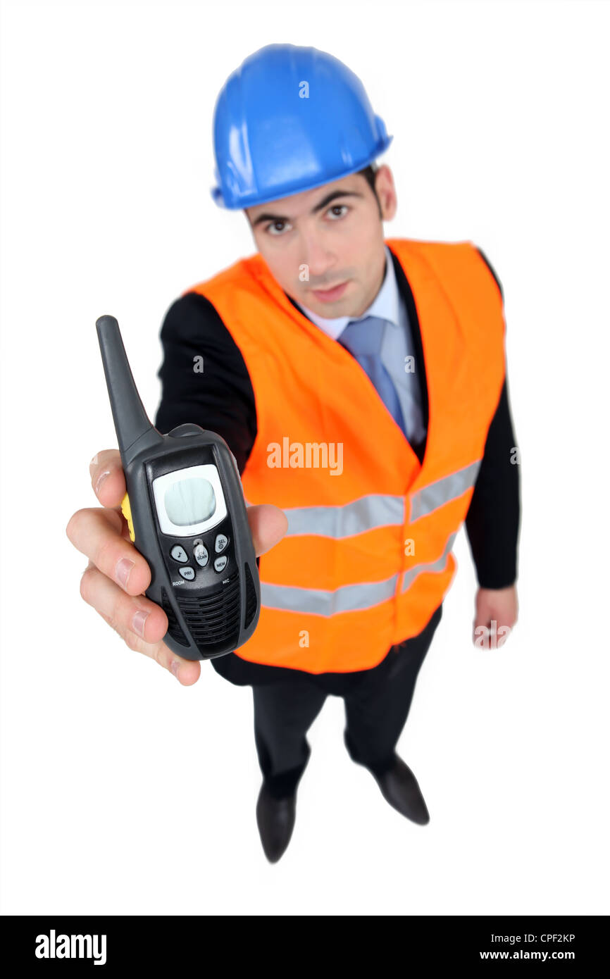 Foreman holding radio receiver Stock Photo - Alamy