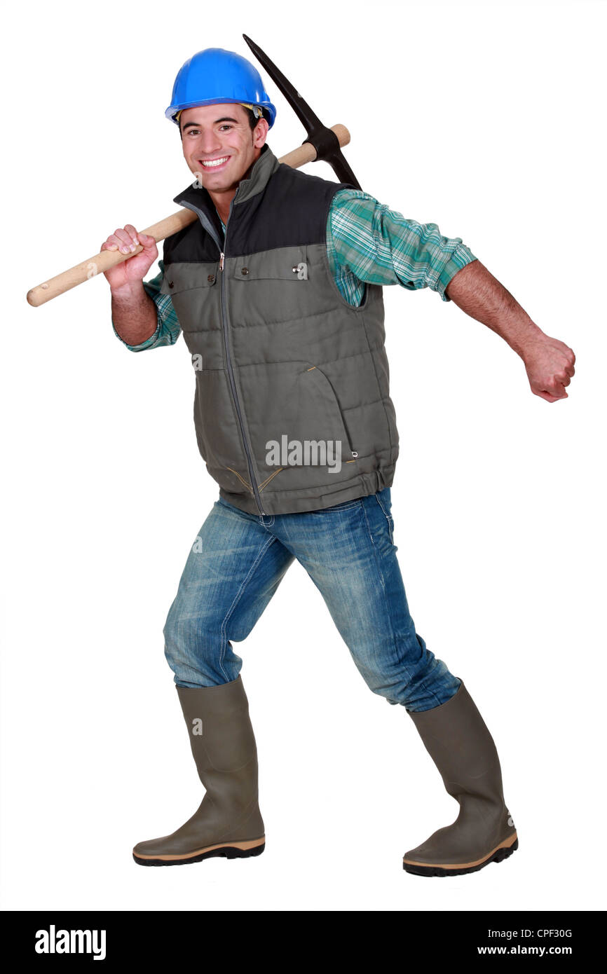 Construction worker with a pickaxe Stock Photo - Alamy