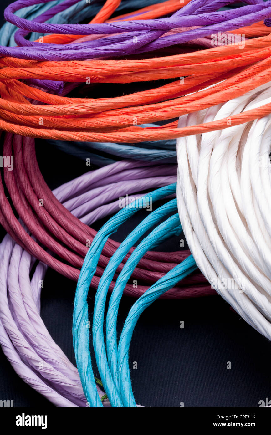 Coiled up bundles of craft paper twists stacked on each other Stock ...