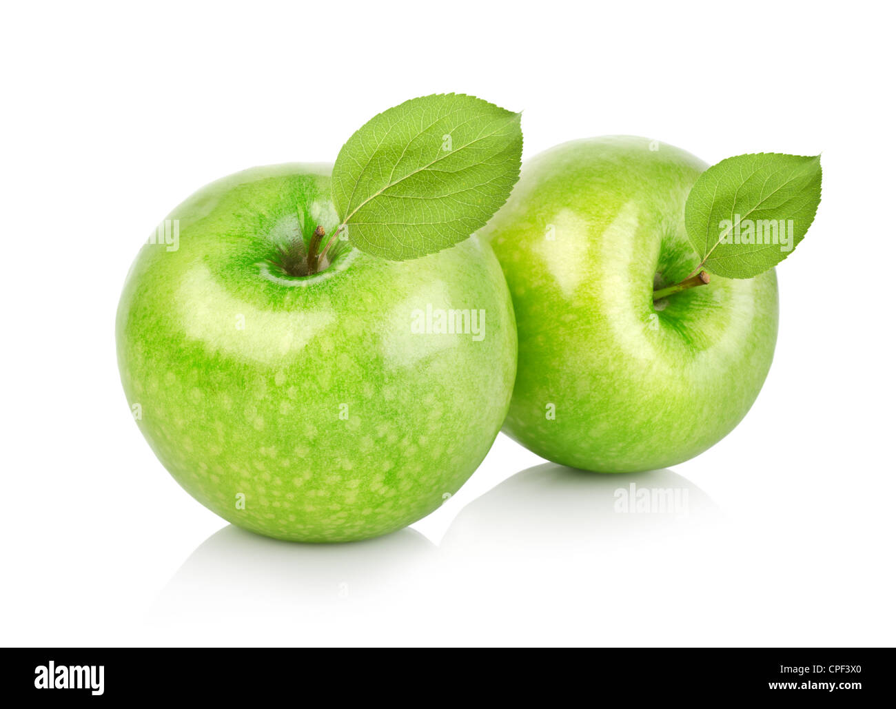 Two green apples with leaves isolated on a white background Stock Photo ...