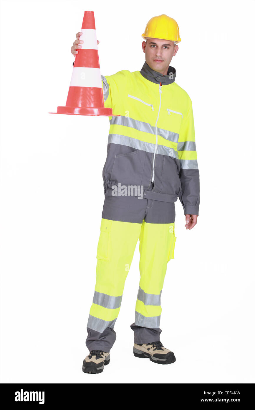 Traffic guard holding a pylon Stock Photo - Alamy